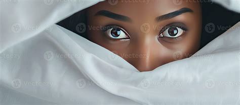 African Girl Hiding Face Under Blanket While Lying In Bed 27186109