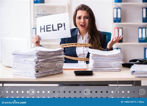 Young Beautiful Employee Tied Up With Rope In The Office Stock Image
