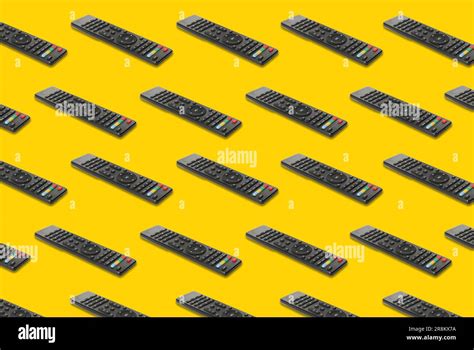Remote Controller Pattern On Yellow Background Collage Design Stock