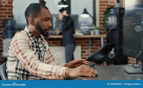 Static Portrait Of African American System Engineer Working Focused