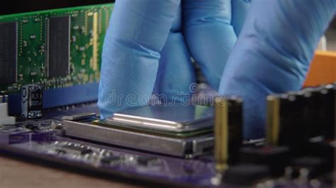 The Process Of Installing A Processor On A Computer Motherboard Stock Video Video Of Industry