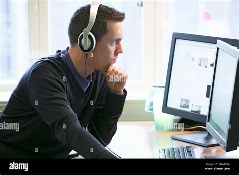 Man Using Computers At Desk Stock Photo Alamy