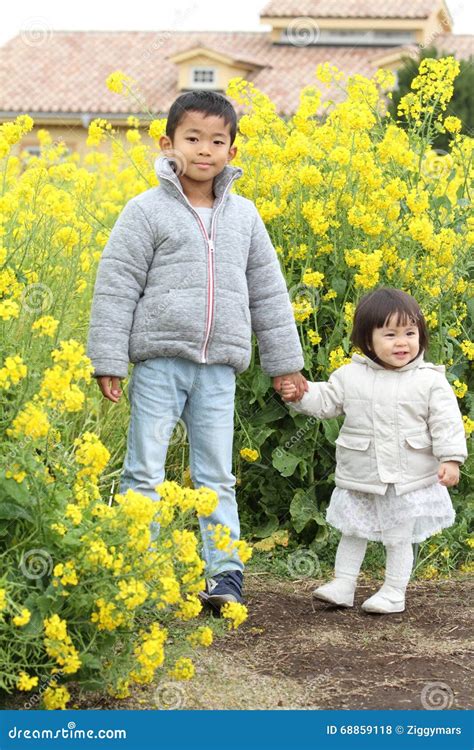 Japanese Brother And Sister Operationg Radio Control Royalty Free Stock