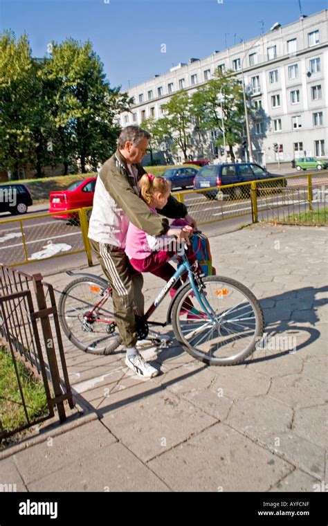 Dad Taking Daughter To School On Bicycle Lodz Central Poland Stock