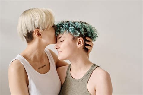 Premium Photo Portrait Of Affectionate Young Couple Embracing Each