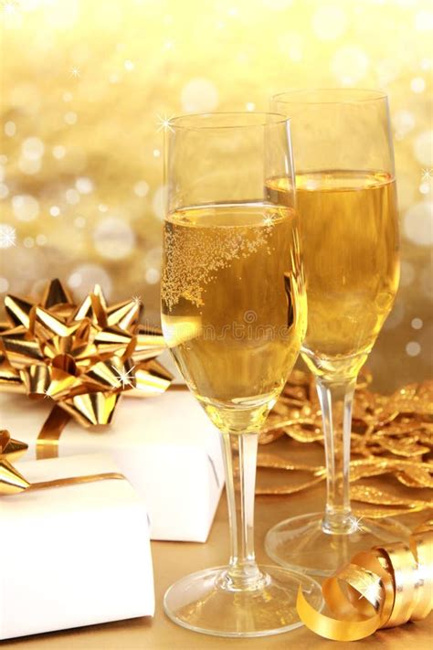 Two Glasses Of Champagne With Bottle Over Black Background Stock Image