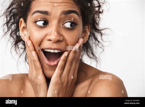 Close Up Of A Beautiful Shocked Young Topless African Woman Posing Over