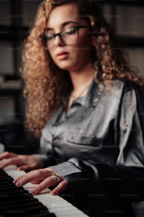 A Womans Hand Resting On A Piano Keyboard Photo Music Art Image On