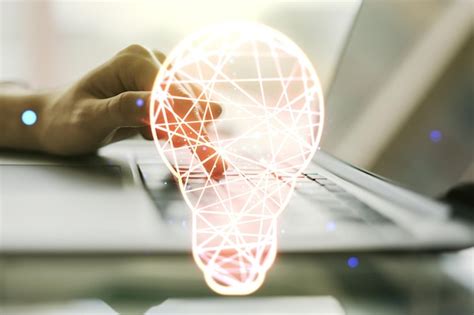 Premium Photo Creative Light Bulb Hologram With Hands Typing On Computer Keyboard On