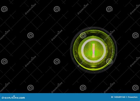 Round Green Power On And Off Button Or Switch With Retro Illumination Glowing In The Dark Macro