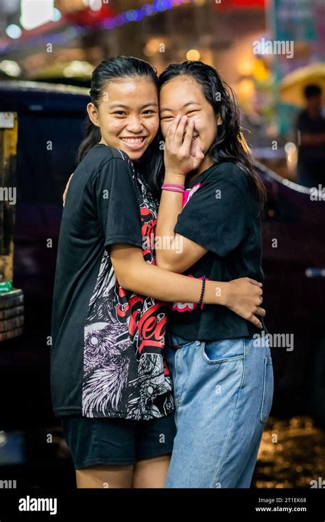 Two Young Pretty Filipino Girls Pose And Smile For Their Portrait In