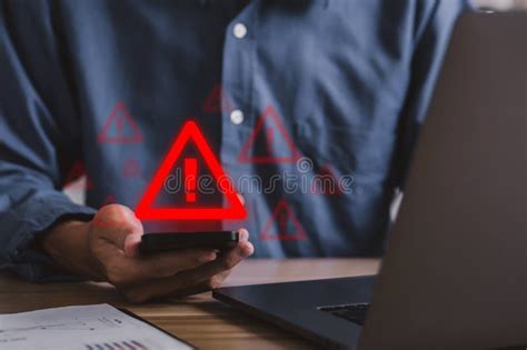 Businessman Using Smartphone With Warning Sign Notification Error And Virus Detection Spyware