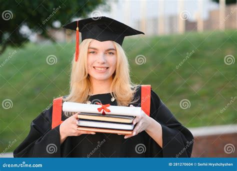 Portrait Enthusiastic Female College Student Graduate In Cap And Gown