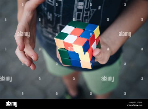 Kid Trying To Solve The Rubik Cube Stock Photo Alamy
