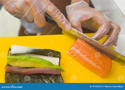Hands In Gloves Of Asian Professional Chef Preparing Delicious And