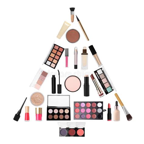Christmas Tree Shape Made With Different Makeup Products On White