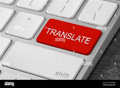 red button with word translate on computer keyboard closeup view stock