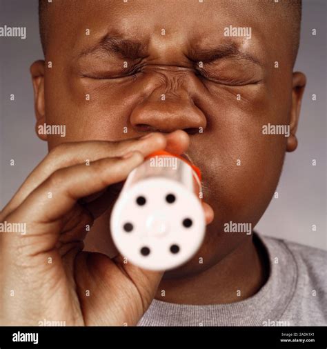 Lung Function Test Babe Breathing Into A Peak Flow Meter Spirometer A Peak Flow Meter Is Used