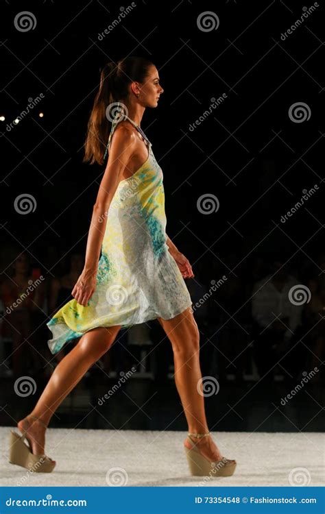 A Model Walks Runway In Designer Swim Apparel During The Caffe Swimwear