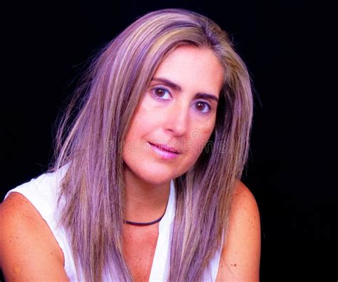 Mature Woman Shows Off Her Blonde Hair With Renewed Color After