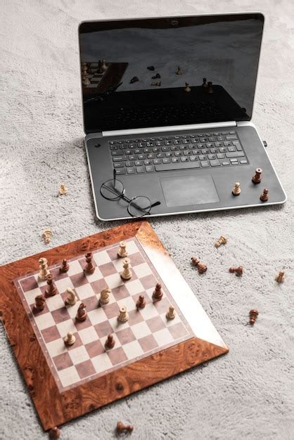 Premium Photo Chess Pieces Glasses And Laptop Or Notebook Computer