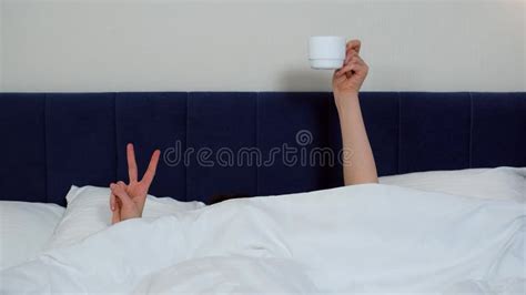 Woman Under Blanket Showing Hand Victory Sogn Anh Holding Cup Of Coffee