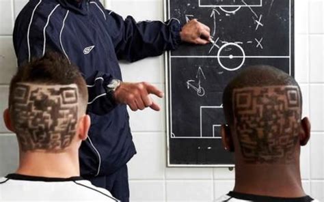 Two Men Standing Next To Each Other In Front Of A Blackboard With A