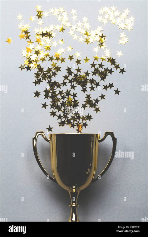 Gold winners trophy with golden shiny stars Stock Photo - Alamy