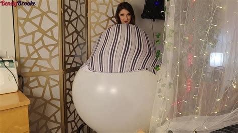 Huge Weather Balloon Belly Inflating In Striped Maternity Dress