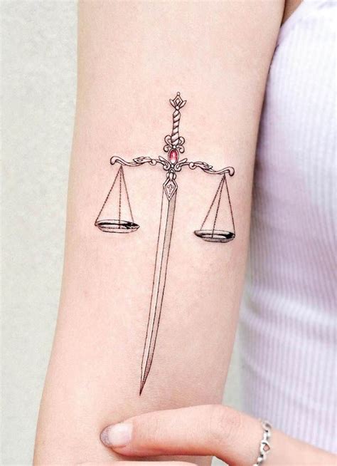 62 Elegant Libra Tattoos With Meaning Libra Tattoo Tattoos Sword Tattoo