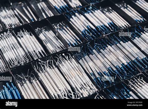 Row Of Many Basic Stainless Steel Dental Tools Supplies On Display In