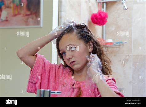 A Young Adolescent Caucasian Girl Dyes Her Hair For The First Time She