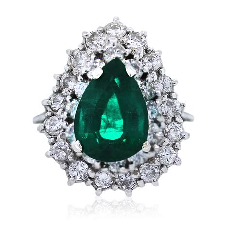 14k White Gold Pear Shaped Emerald And Diamond Cluster Ring