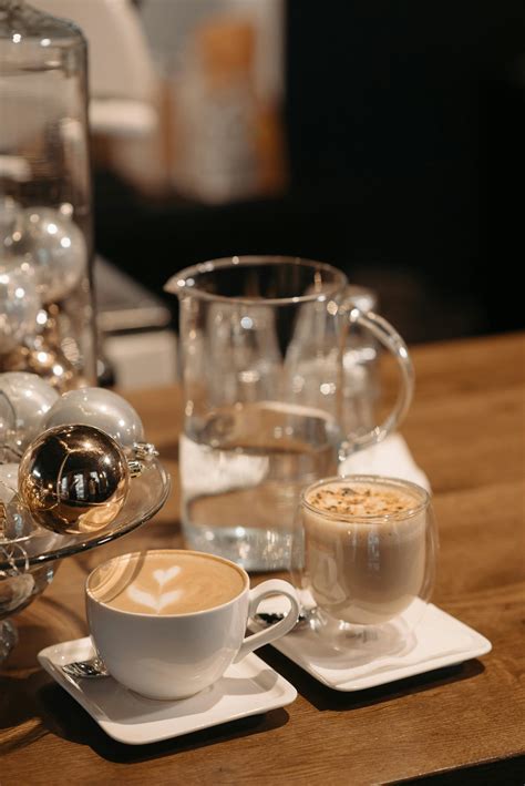 White Flower Vase Beside Clear Drinking Glass And Pitcher · Free Stock
