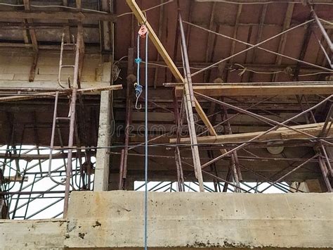 Building Framework With Visible Scaffolding Rope Systems And Signs Of Ongoing Development And