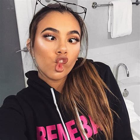 A Woman Sticking Her Tongue Out In The Bathroom