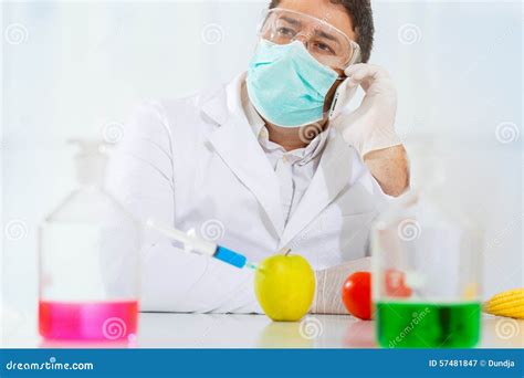 Scientist Genetically Modifying Fruits And Vegetables In The Laboratory