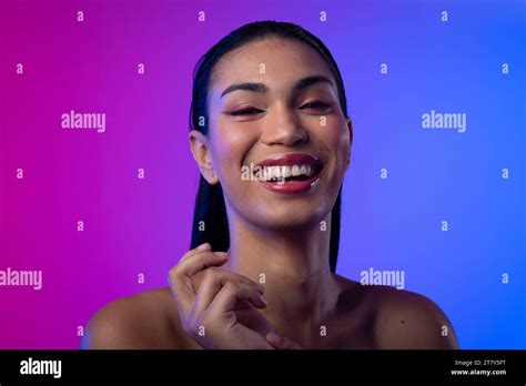 Portrait Of Smiling Biracial Woman With Dark Hair Red Lips Eyeshadow