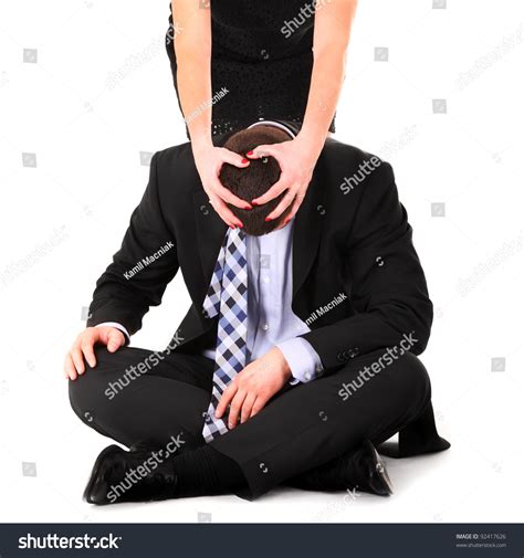 A Picture Of A Woman Dominating A Man Over White Background Stock Photo