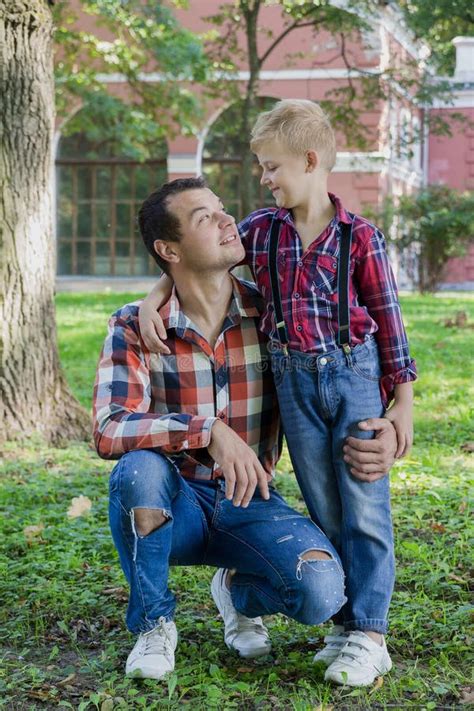 Beautiful Dad And Son Are Walking In The Park Stock Image Image Of