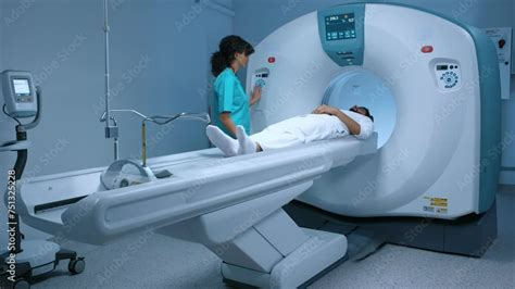 Professional Doctor Performs Emergency Examination Procedure Using