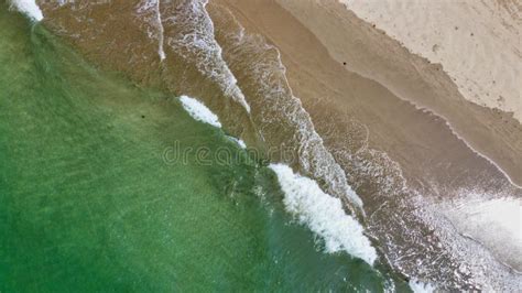 Burmese Fishermen Bear Caught Fish In Baskets On The Beach Ngwe Saung