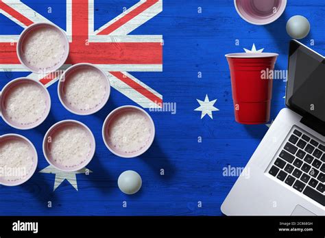 Australia Flag Concept With Plastic Beer Pong Cups And Laptop On