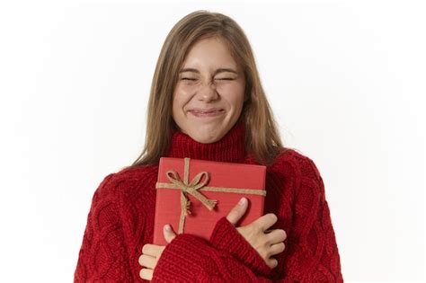 Free Photo Excited Ecstatic Girl In Cozy Knitted Sweater Keeping Eyes