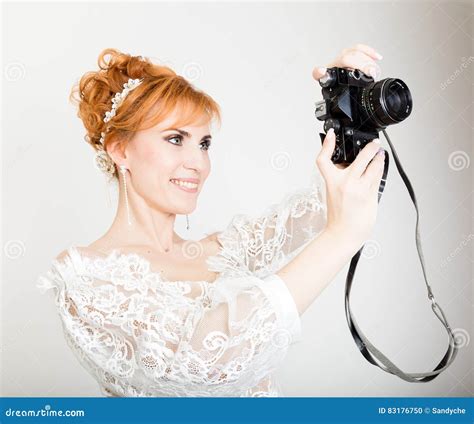 Beautiful Young Redhead Bride Wearing White Wedding Dress With