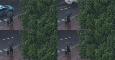 大雨中街头等车的情侣01视频素材下载