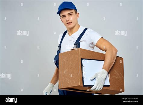 Man Worker With Box In Hands Delivery Loading Service Packing Service Stock Photo Alamy