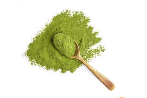Premium Photo Dried Organic Wheatgrass Powder In Wooden Spoon