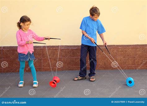 Brother And Sister Play With Yo Yo Toy Stock Image Image Of Pink Cheerful 26337909