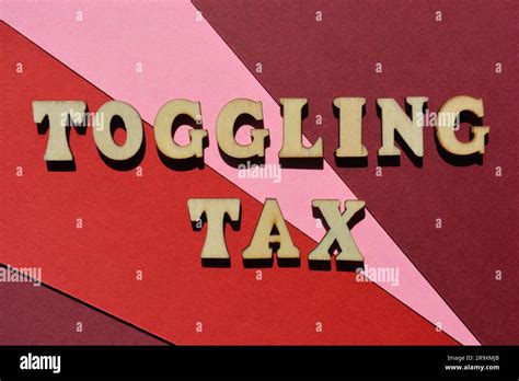 Toggling Tax Words In Wooden Alphabet Letters Isolated On Red